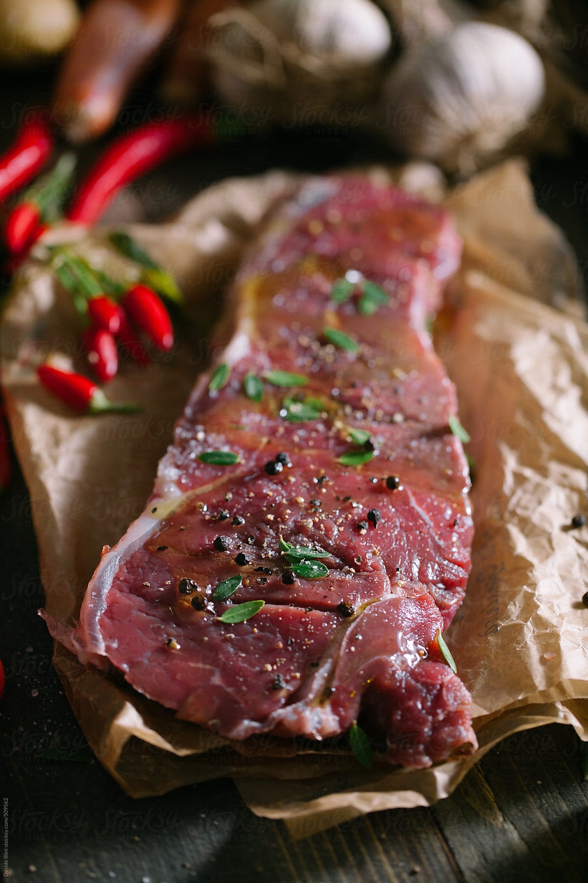 "Raw Beef Steak" by Stocksy Contributor "Davide Illini" - Stocksy