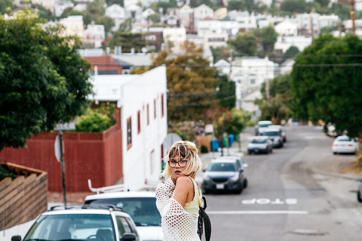 "Young Woman Walks Through City Streets Urban Environment" by Stocksy ...