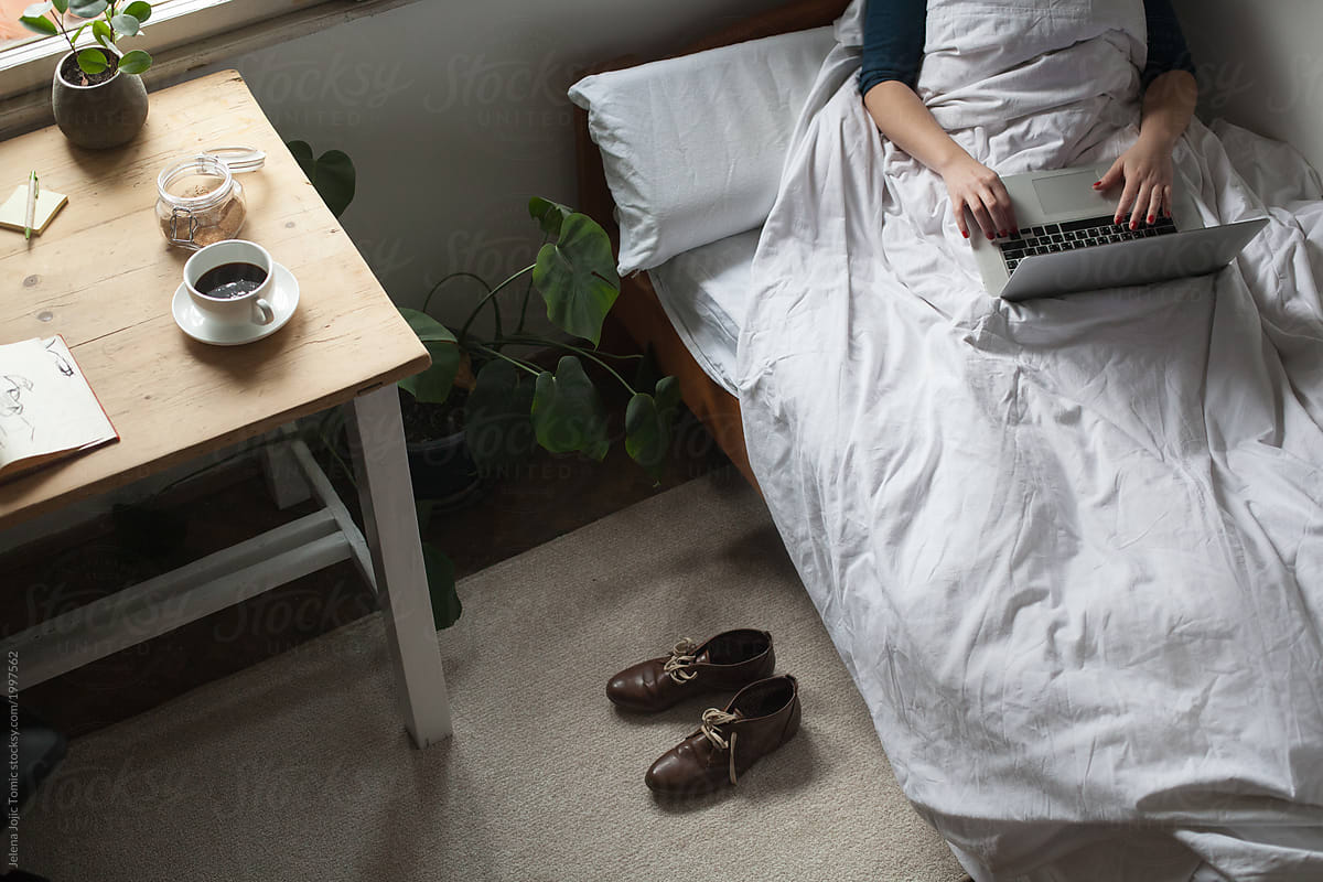 "Working Bedroom" by Stocksy Contributor "Jelena Jojic Tomic" - Stocksy