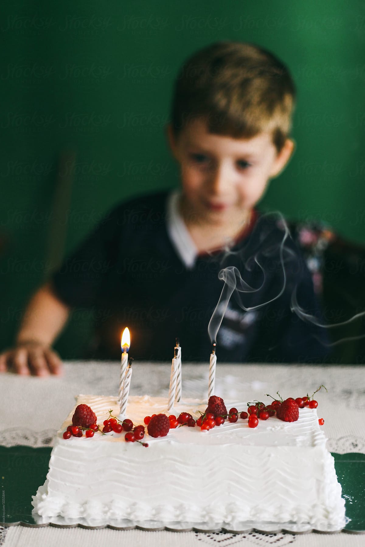 "Kid Looking At The Cake" by Stocksy Contributor "Marija Kovac" - Stocksy
