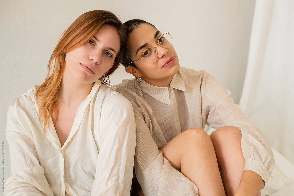"Two Women In Cream Tones Outfits Lean On Each Other" by Stocksy ...
