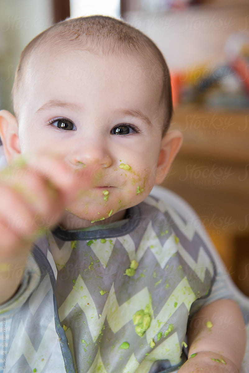 "Baby Has Messy Face While Eating" by Stocksy Contributor "Cara Dolan ...