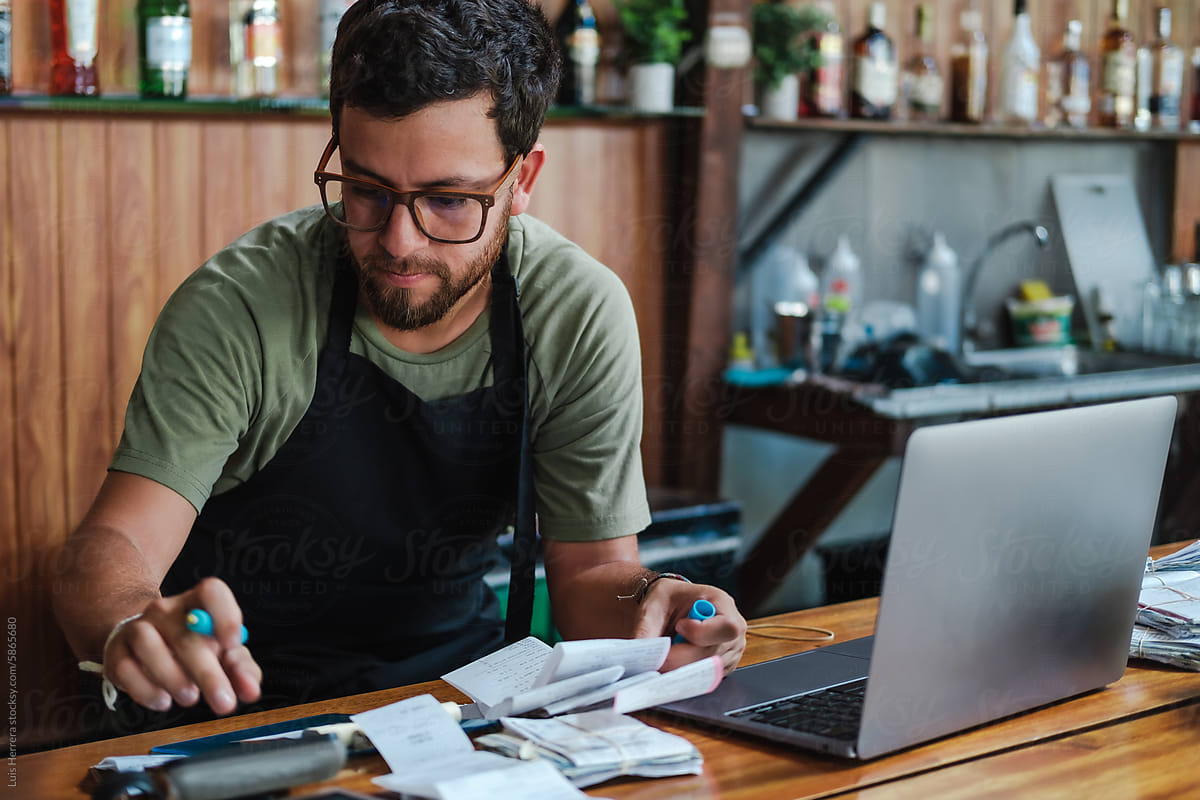 "Working With Receipts And A Computer Doing Financial Work" by Stocksy ...