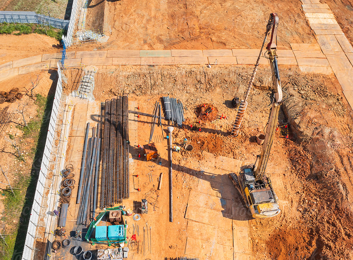 "Excavator Digging Foundation Hole At Construction Site, Aerial View ...