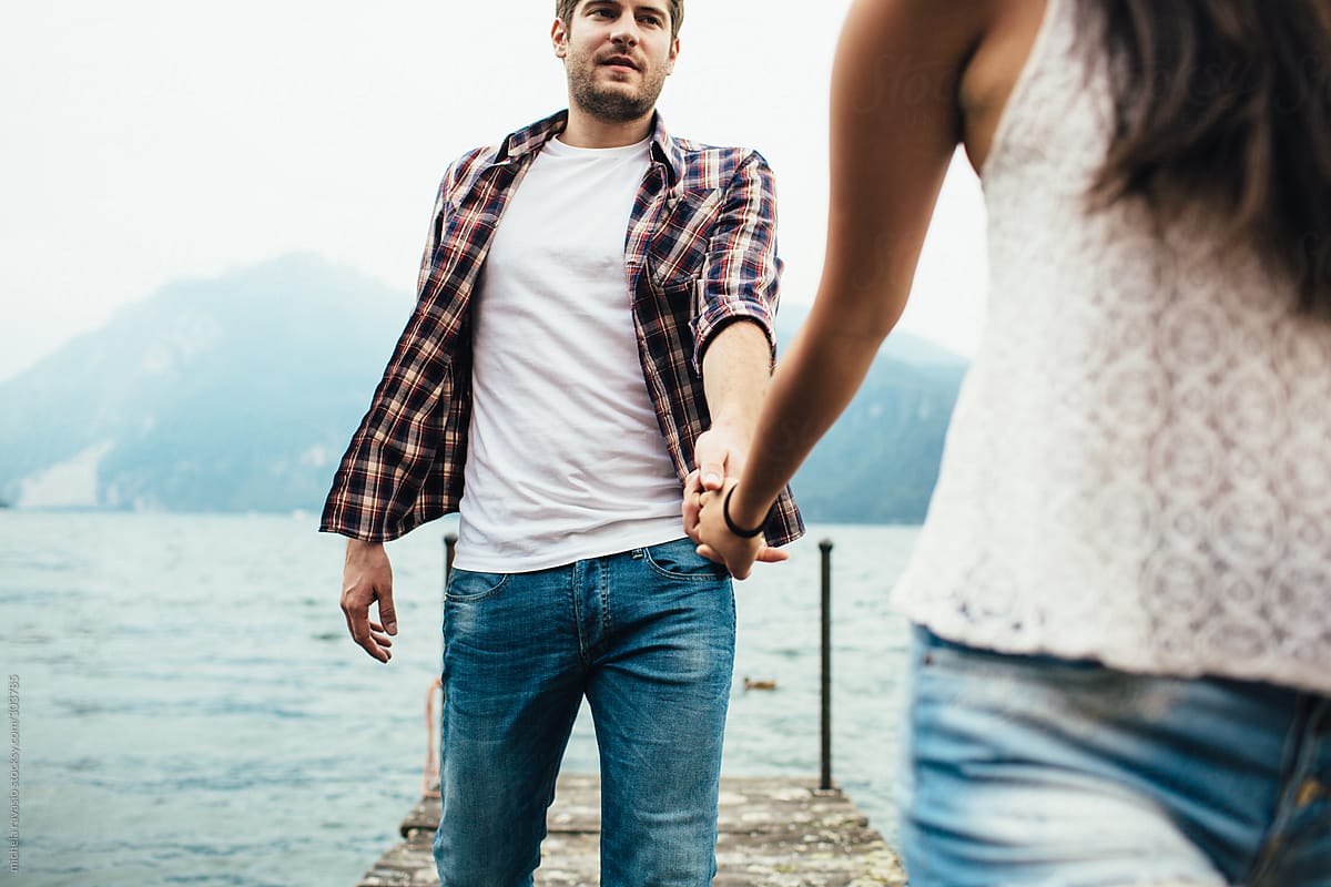 "Young Man Following His Girlfriend" by Stocksy Contributor "Michela ...