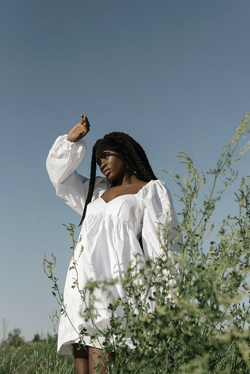 "Confident Black Woman Hiding From Sunlight In Field" by Stocksy ...
