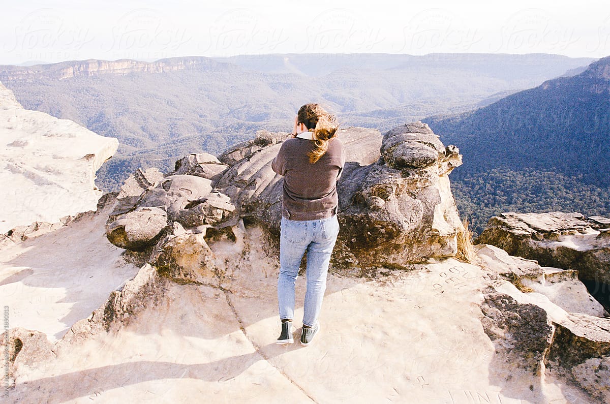 "Brunette Woman Standing On Cliff" by Stocksy Contributor "Kayla ...