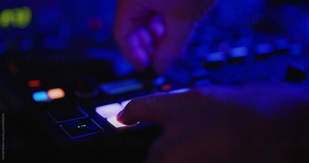 "DJ Mixing With Stems" by Stocksy Contributor "Harald Walker" - Stocksy