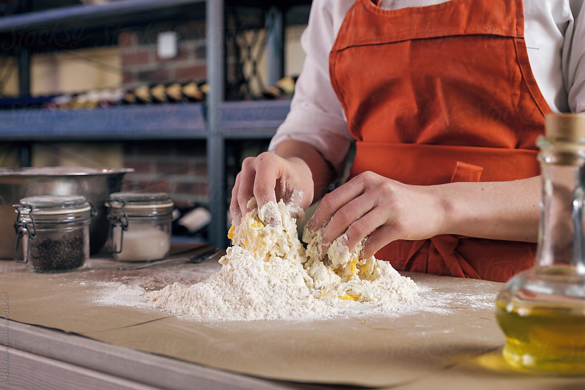 "Person Beating Dough" by Stocksy Contributor "Danil Nevsky" - Stocksy