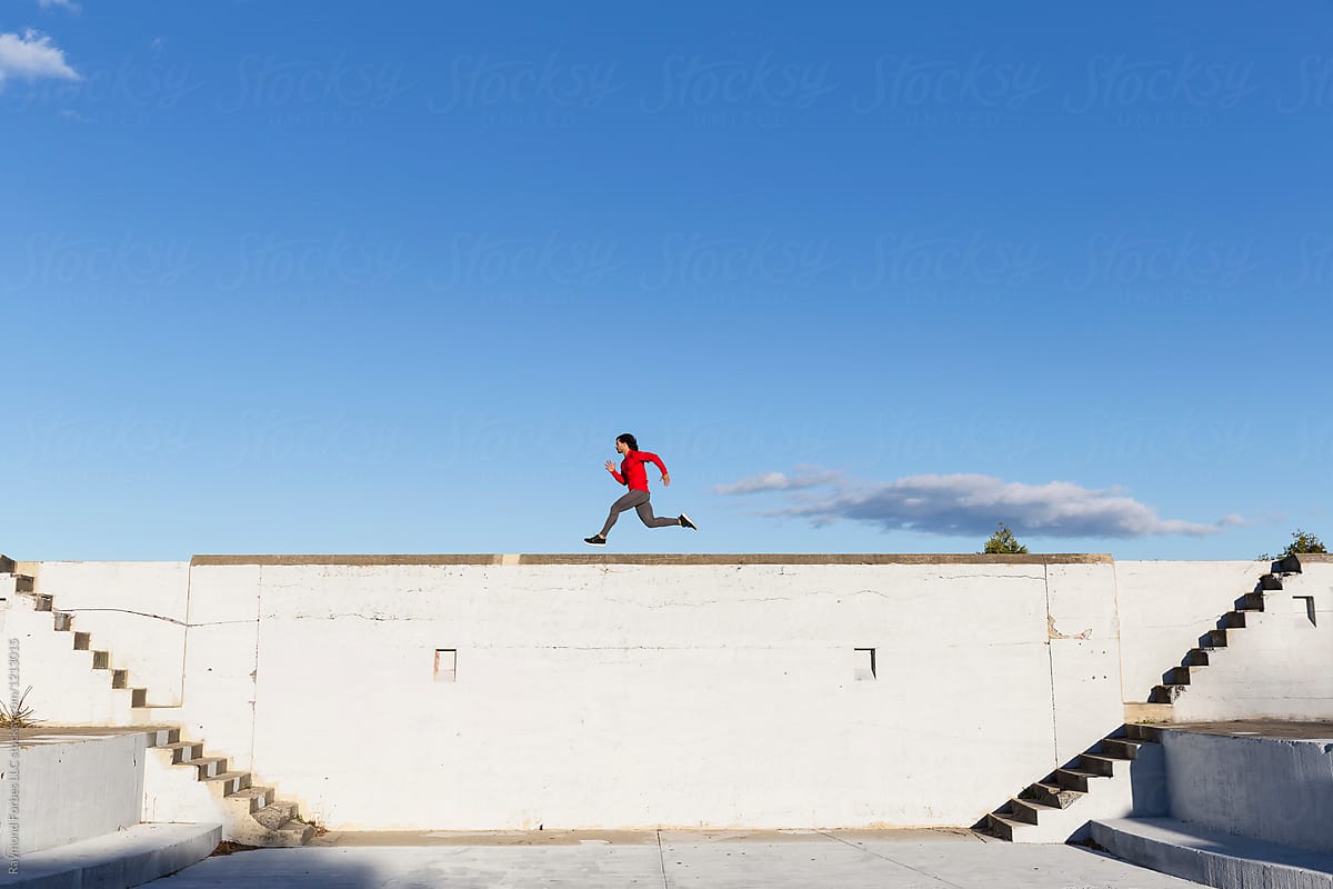 "Athlete Running During And Jumping At Outdoor Graphic Location" by ...