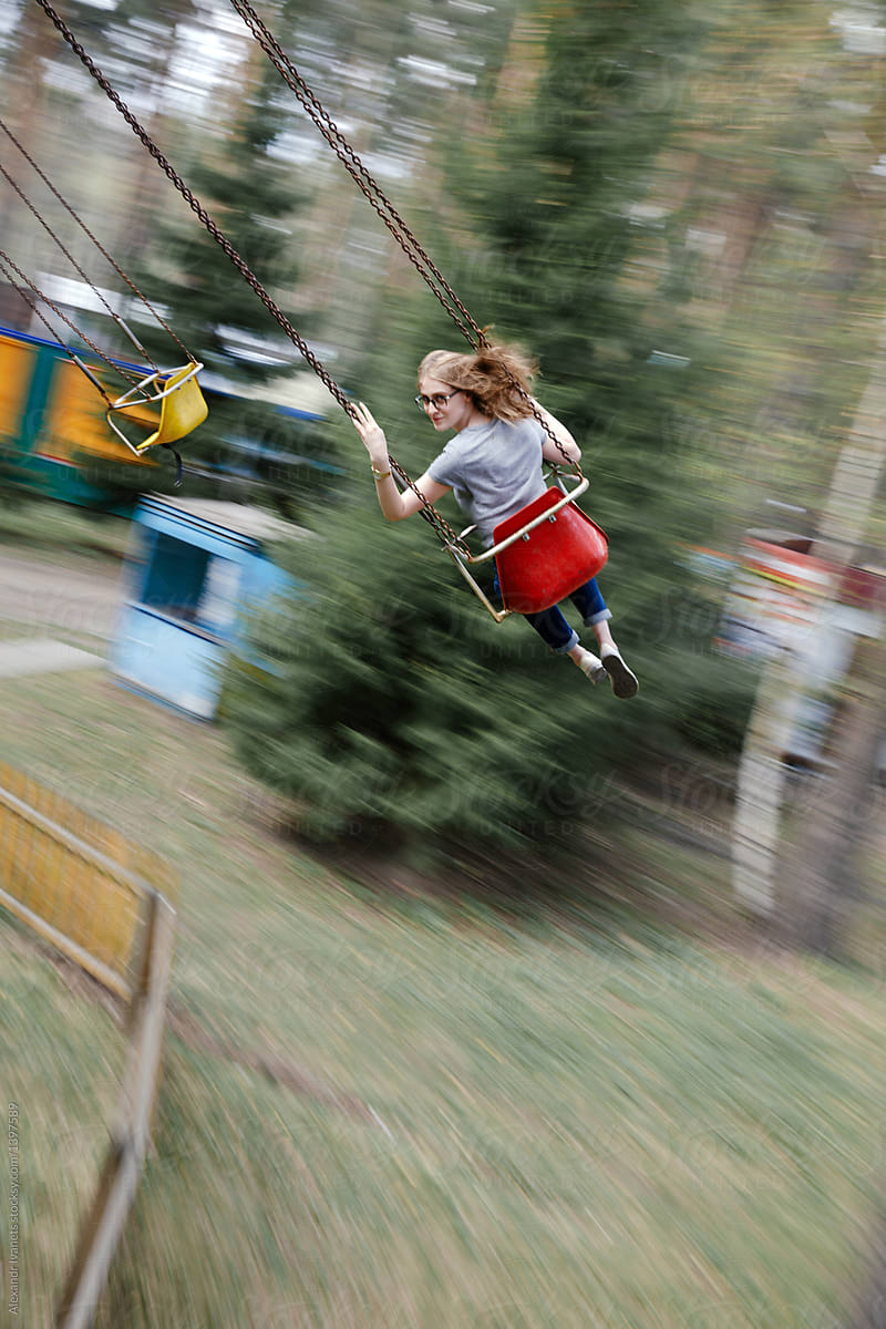 "Female On Swings In Motion" by Stocksy Contributor "Alexandr Ivanets ...