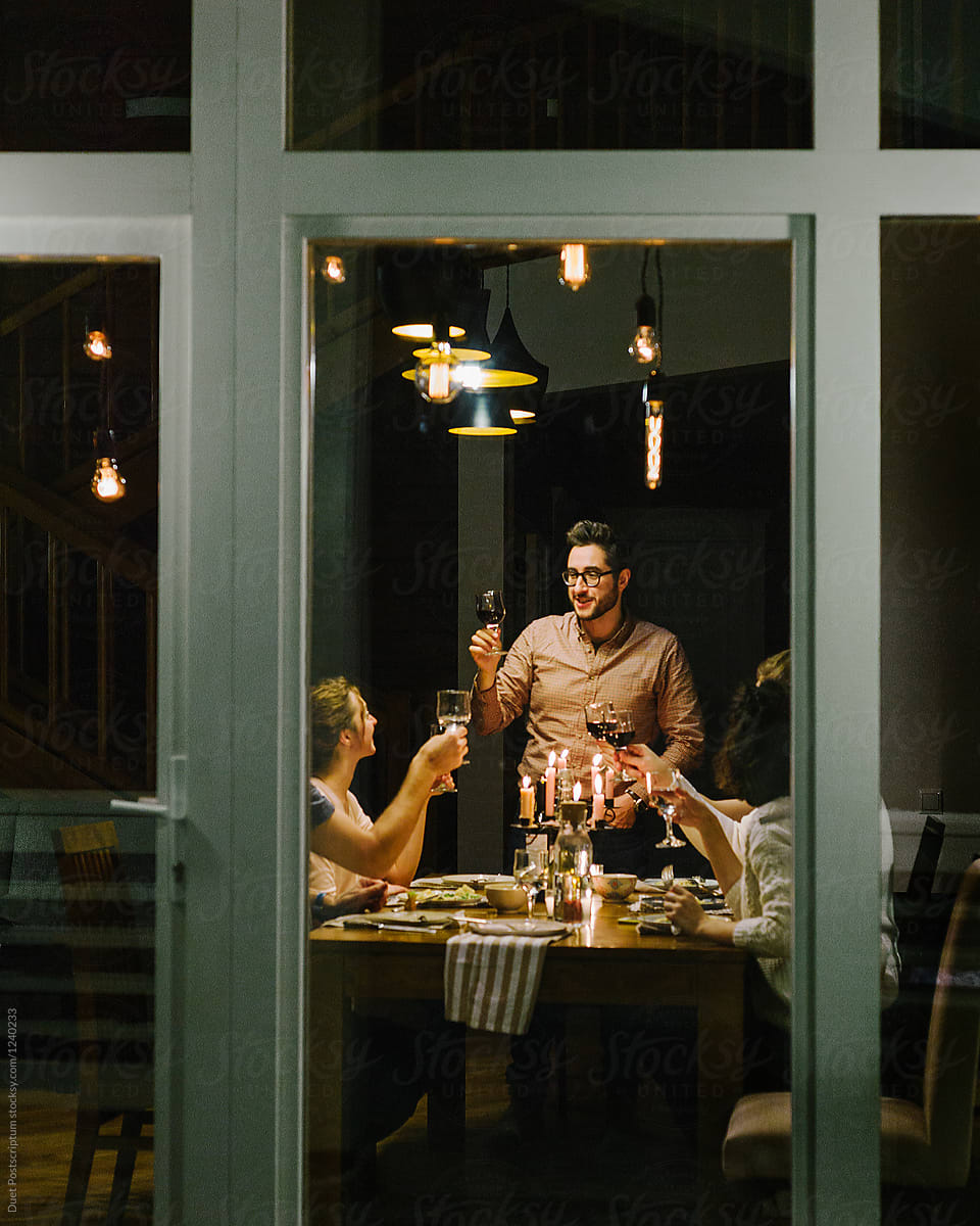 "Shot Through Glass At Friends Reunion" by Stocksy Contributor "Duet ...