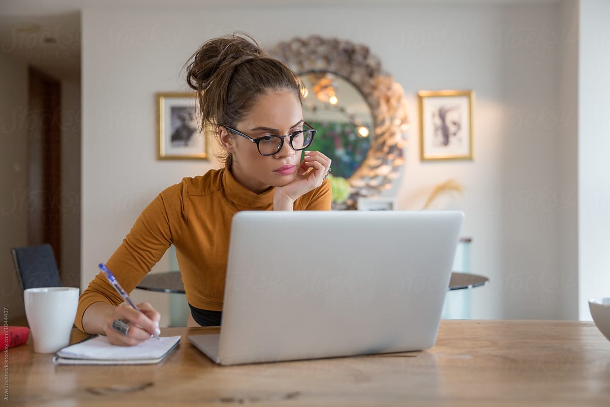 "Young Woman Concentrating On Work At Home" by Stocksy Contributor ...