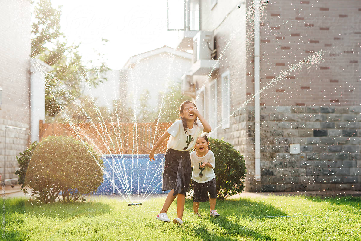 "Cute Girl Playing In Backyard" by Stocksy Contributor "MaaHoo" - Stocksy
