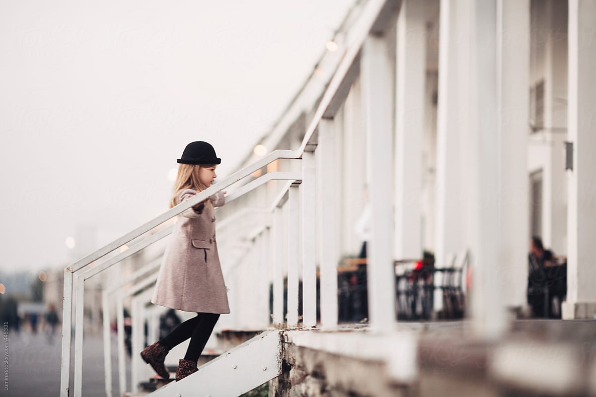"Girl Climbing The Stairs" by Stocksy Contributor "Lumina" - Stocksy