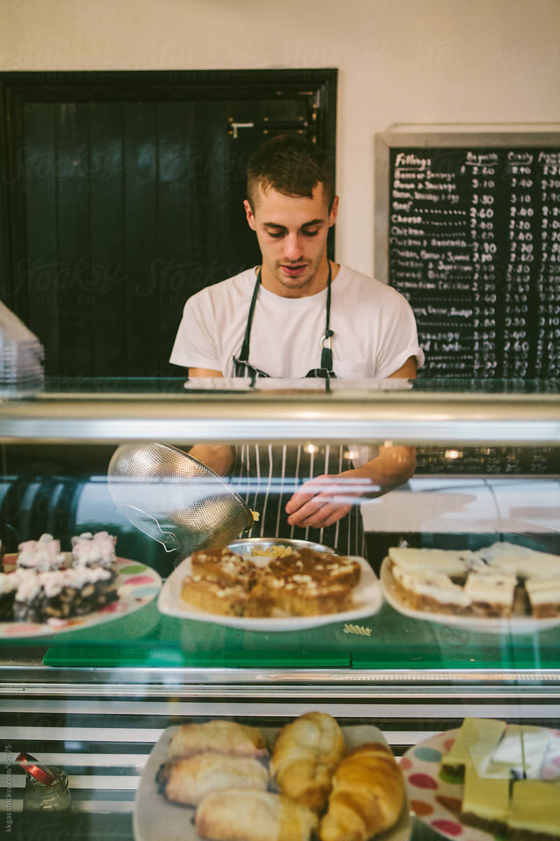 "Man Making Sandwiches In Cafe" by Stocksy Contributor "Kkgas" - Stocksy
