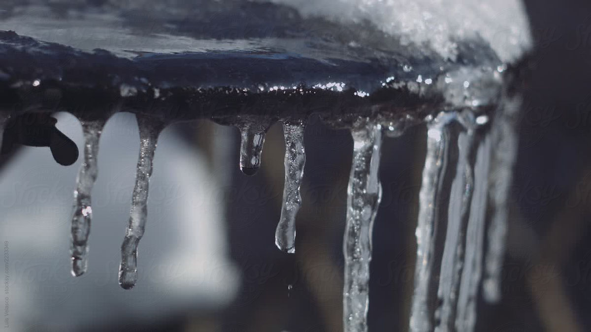 "Melting Snow. Icicle." by Stocksy Contributor "Luis Velasco" - Stocksy