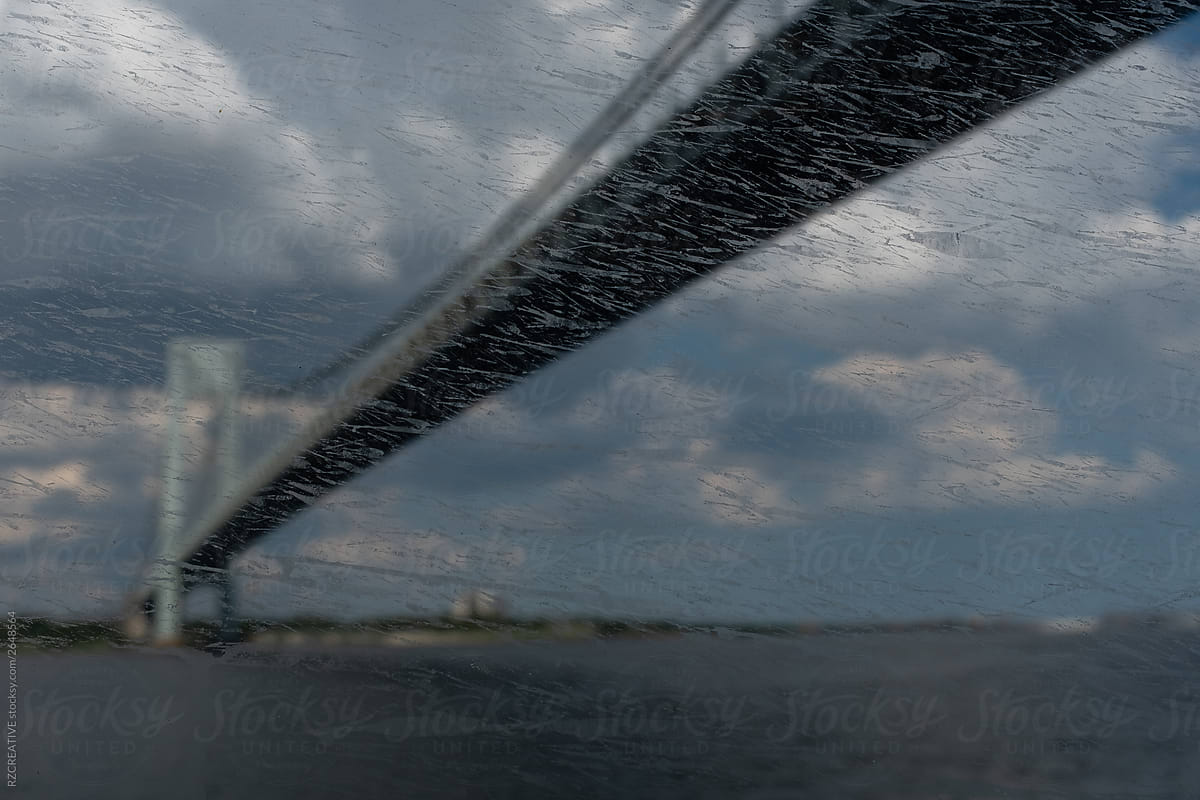 "Under A Bridge From Worn Windows Of A Ferry Boat." by Stocksy ...