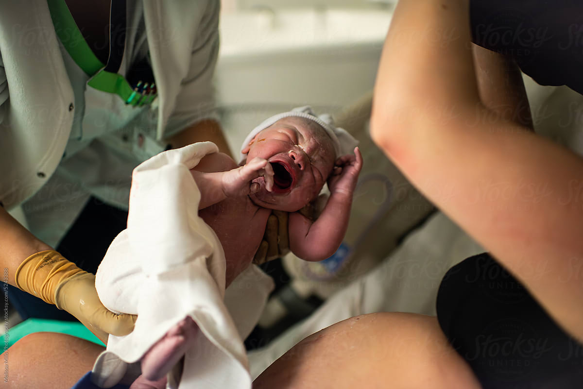 "Midwife Handing Over Newborn Baby To Mother" by Stocksy Contributor ...