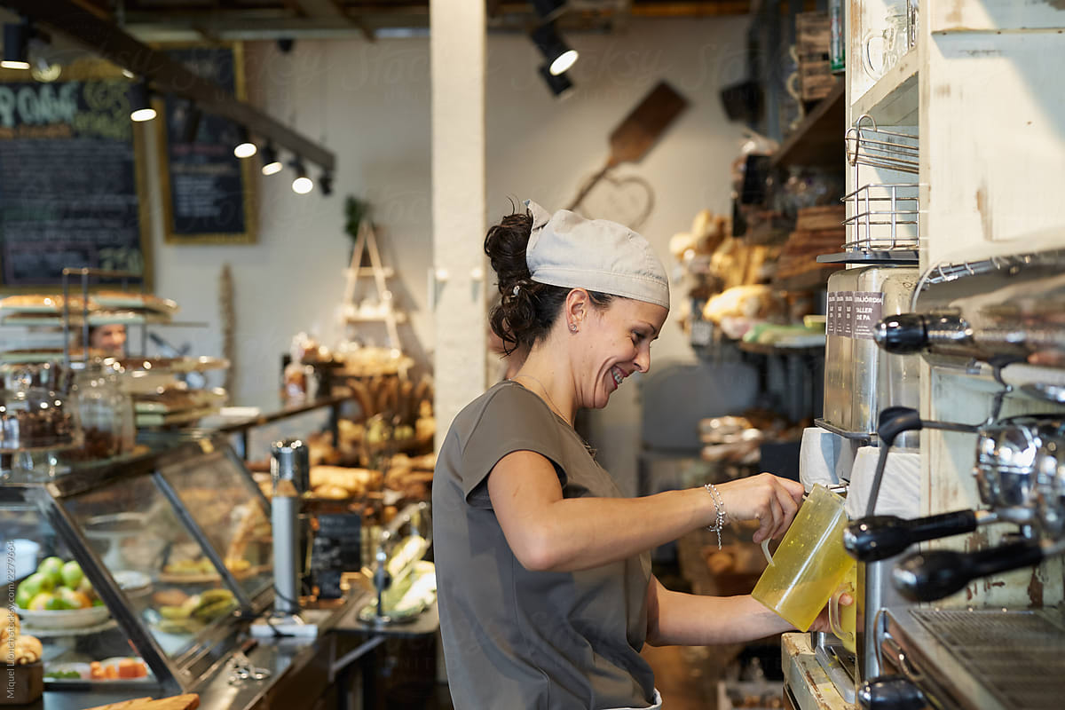 "Waitress Preparing An Orange Juice" by Stocksy Contributor "Miquel ...