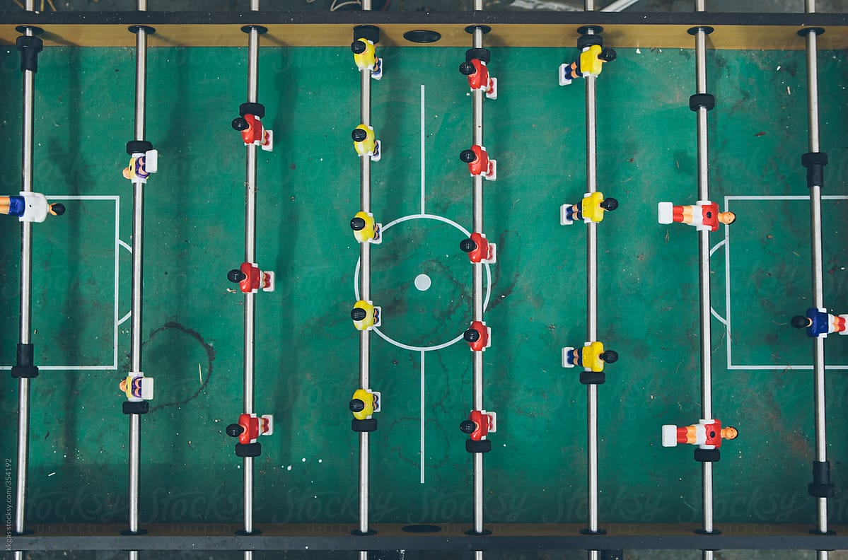 "Table Football" by Stocksy Contributor "Kkgas" - Stocksy