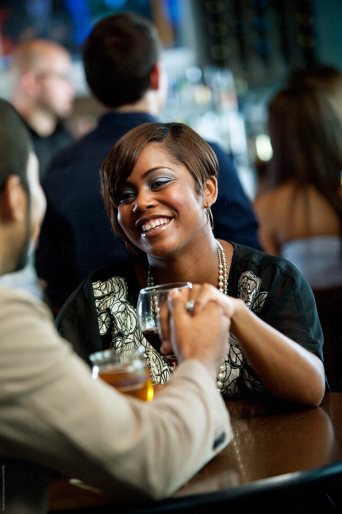 "Bar: Holding Hands At Date Night" by Stocksy Contributor "Sean Locke ...