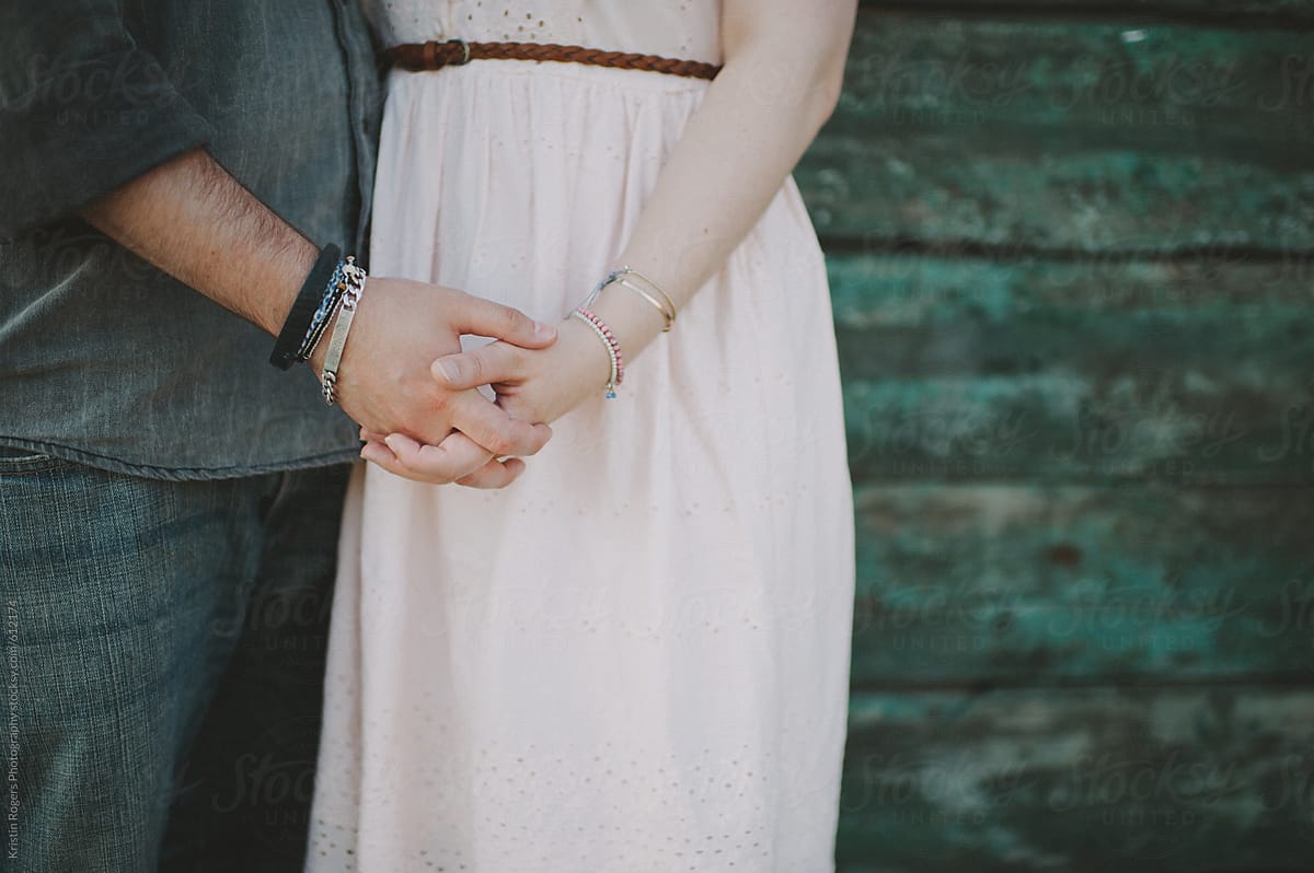 "Couple On Date Holding Hands" by Stocksy Contributor "Kristin Rogers ...