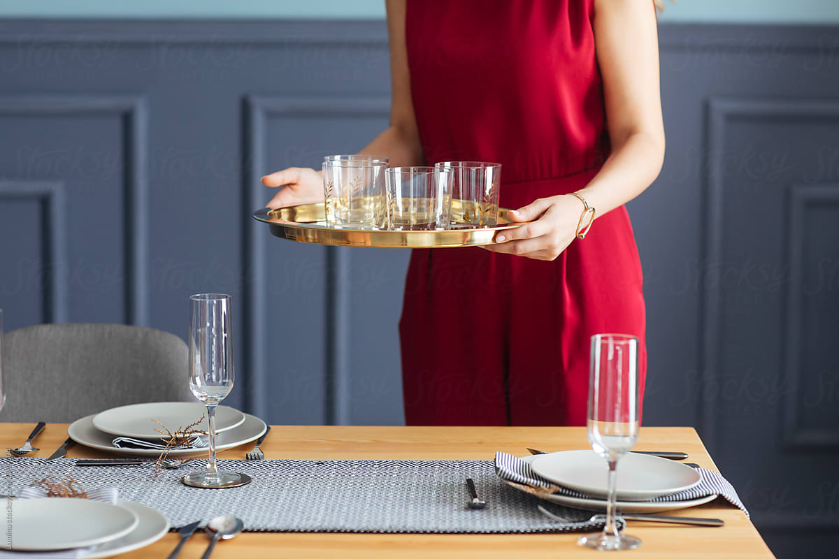 "Woman Setting Up Christmas Dinner Table" by Stocksy Contributor ...
