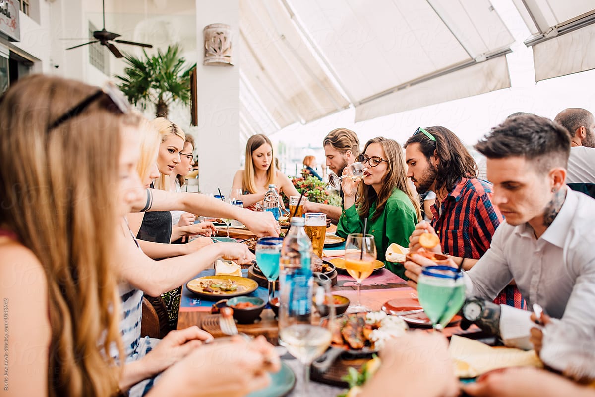 "Friends Enjoying Their Meal In The Restaurant" by Stocksy Contributor ...