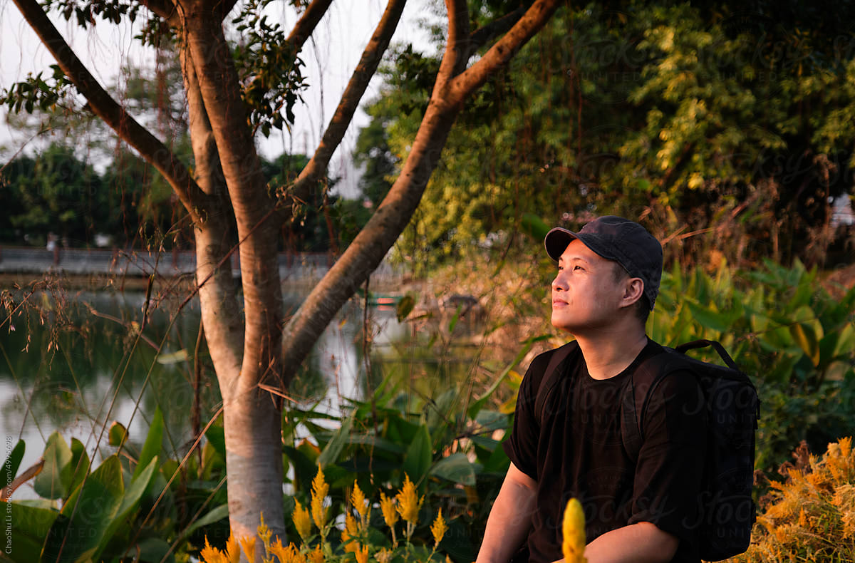 "Asian Man In The Woods" by Stocksy Contributor "ChaoShu Li" - Stocksy