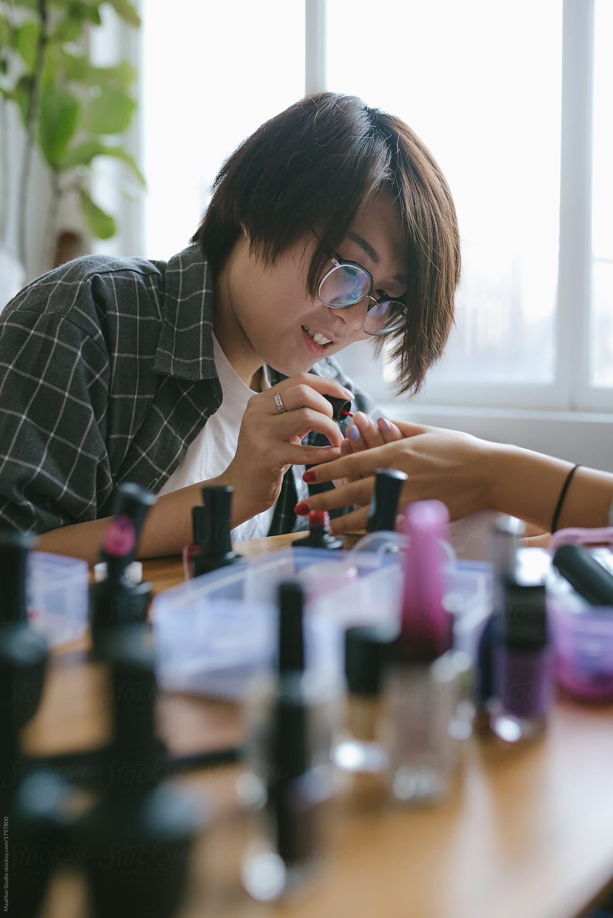 "Girls Doing Their Nails At Home" by Stocksy Contributor "MaaHoo" - Stocksy