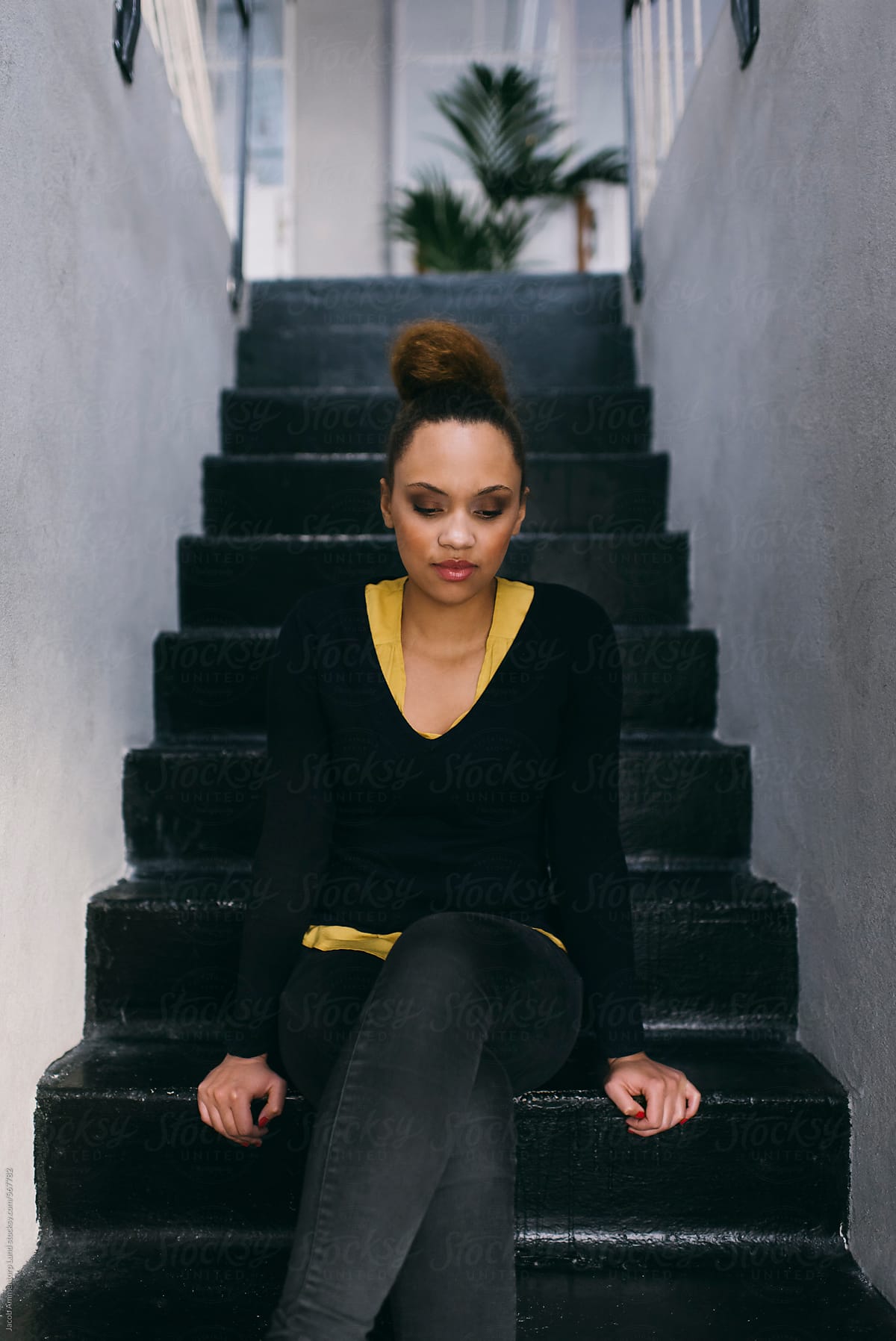 "Young Woman Sitting On Steps Looking Down In Thought" by Stocksy ...