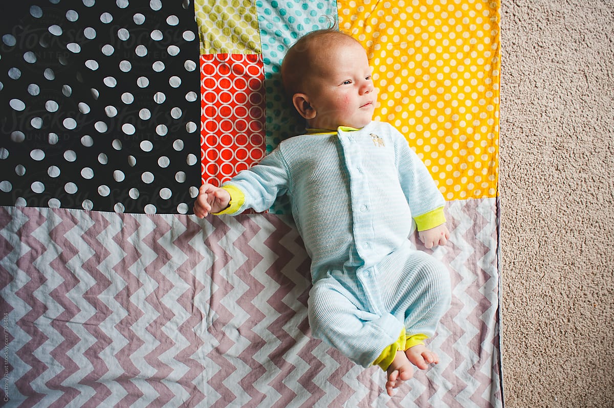 "Baby Doing Floor Time On A Blanket" by Stocksy Contributor "Courtney ...