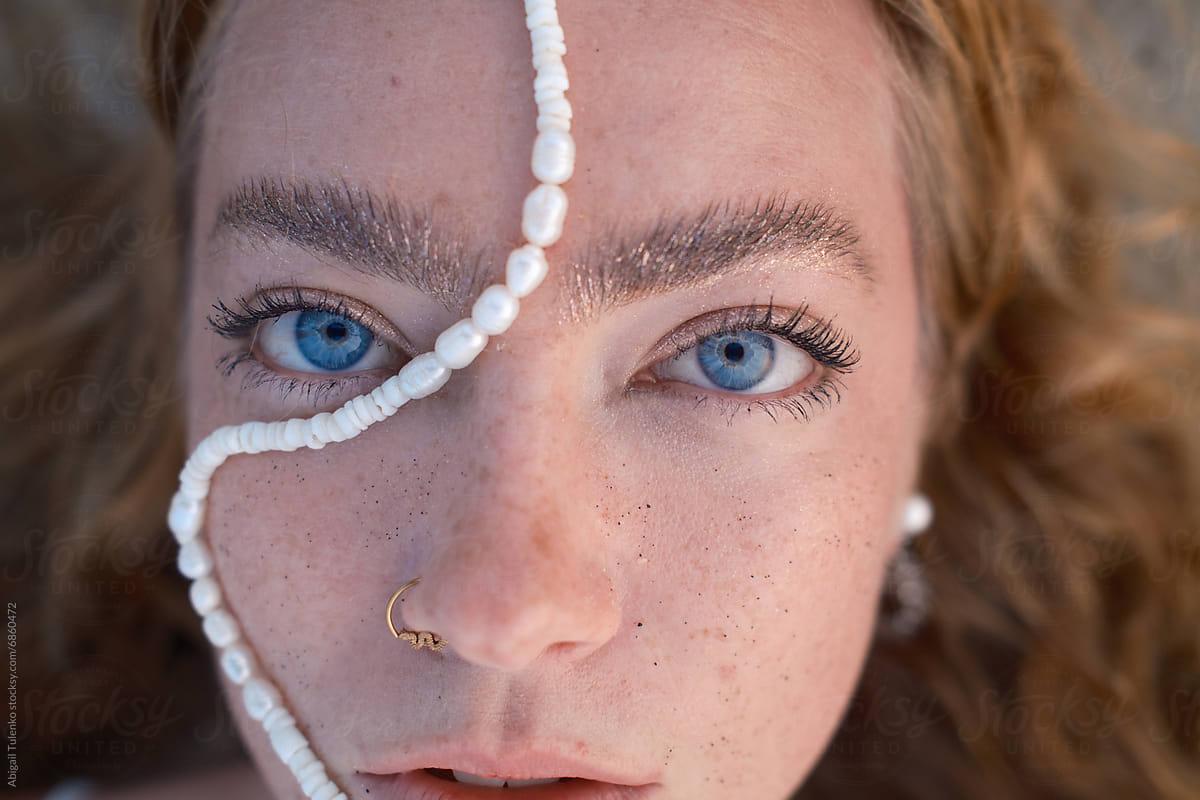 "Redheaded Girl With Pearls On Face" by Stocksy Contributor "Abigail ...