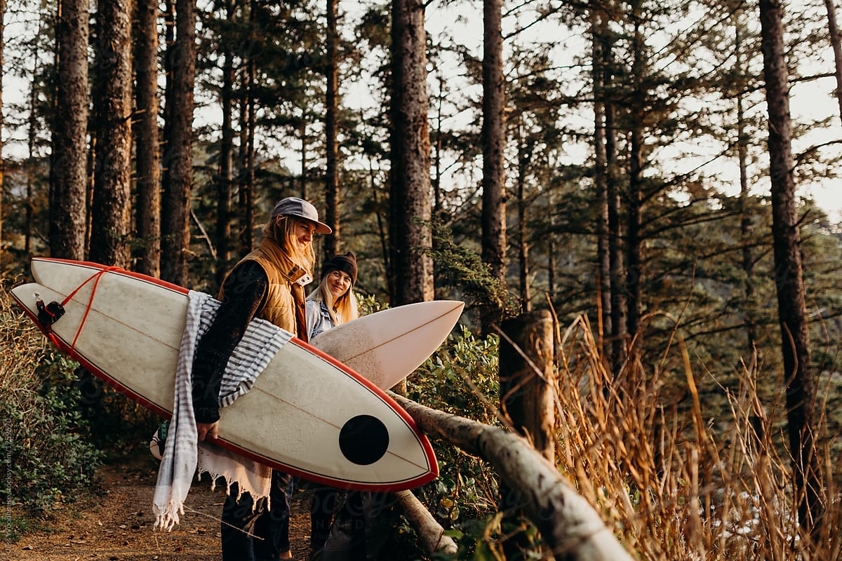 "A Young Couple With Surfboards In The Forest" by Stocksy Contributor ...