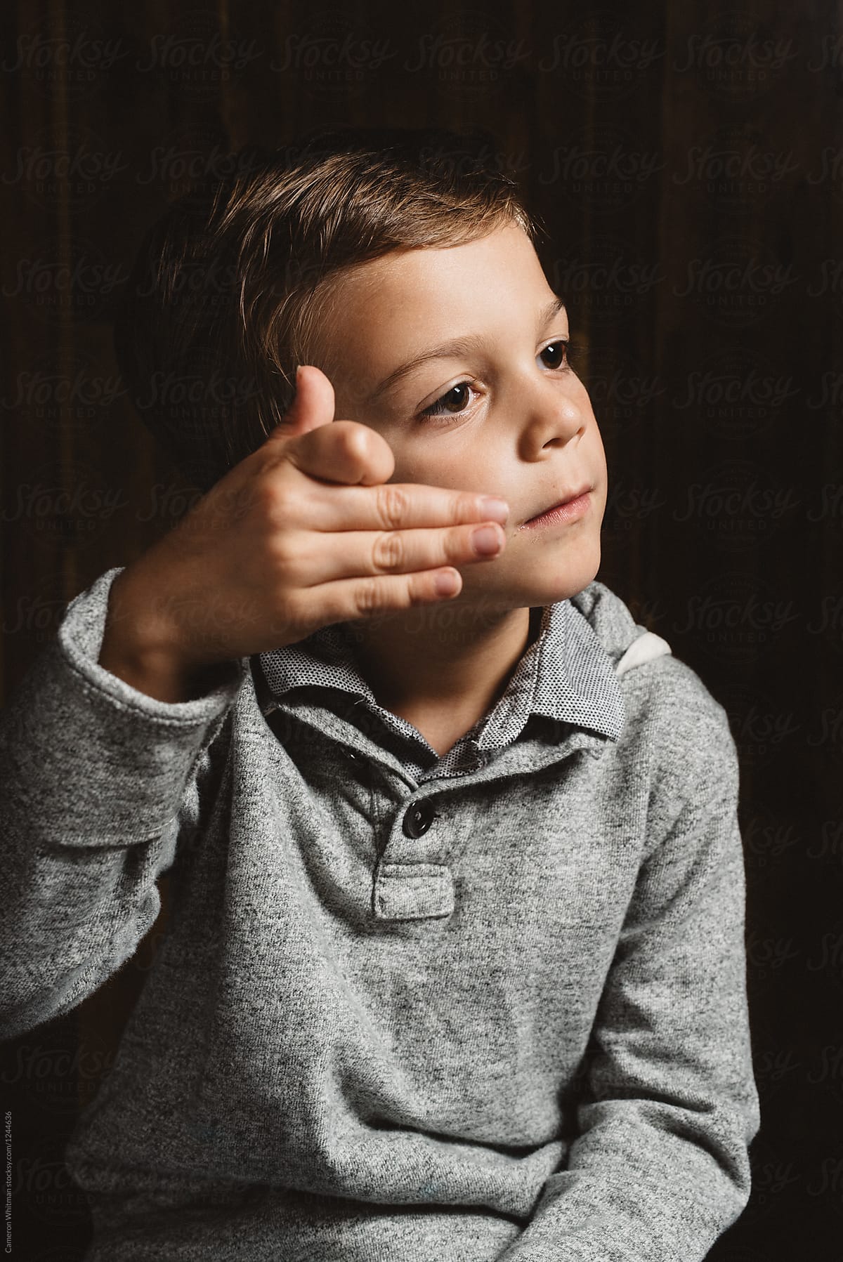 "Dog Face Hand Gesture" by Stocksy Contributor "CWP, LLC" - Stocksy