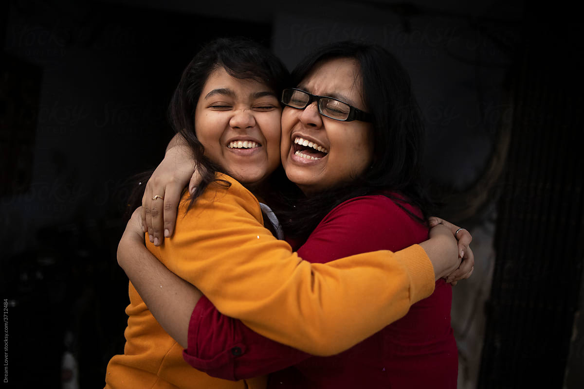 "Two Sisters Interacting And Hugging And Making Fun" by Stocksy ...