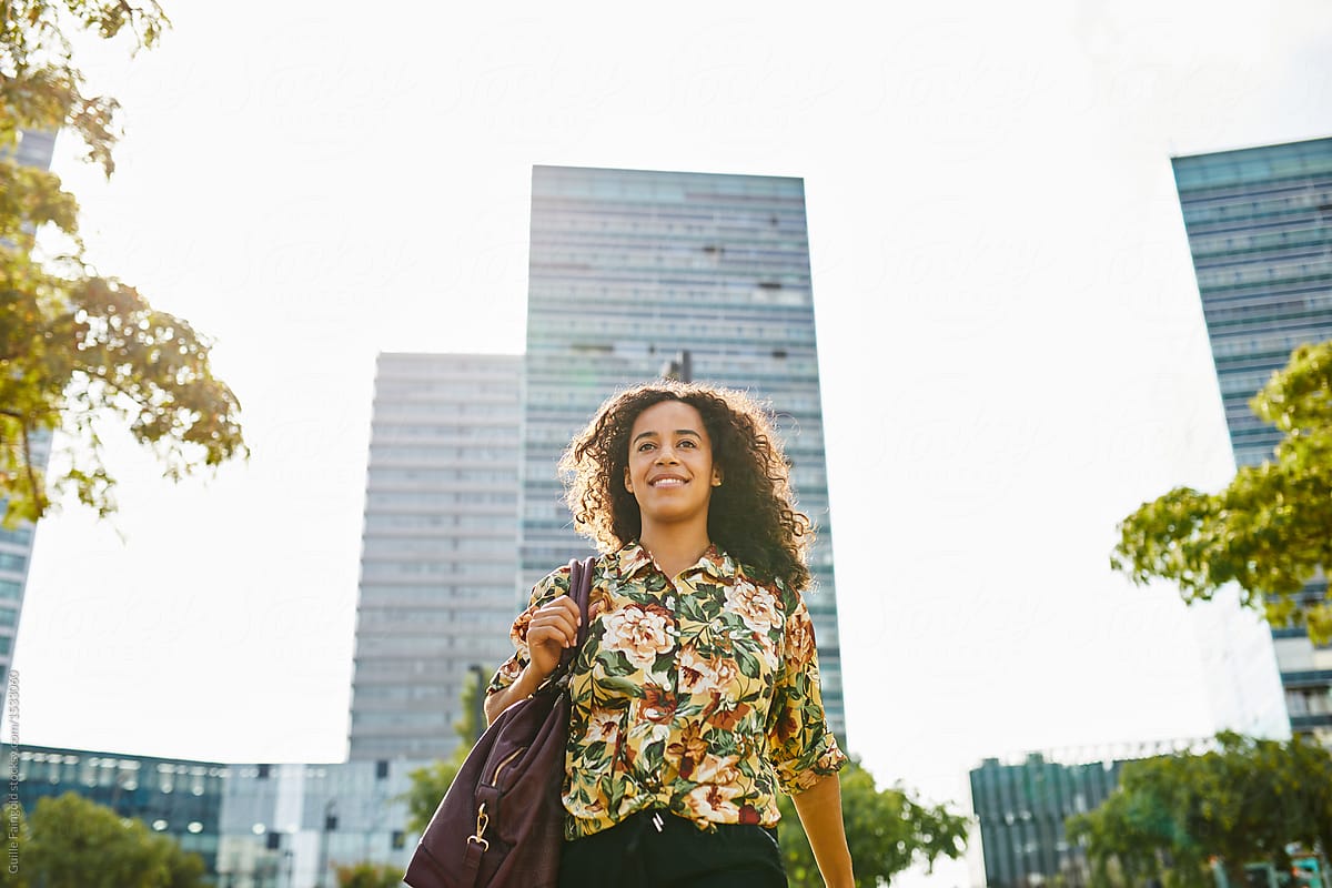 "Happy Businesswoman Walking" by Stocksy Contributor "Guille Faingold ...