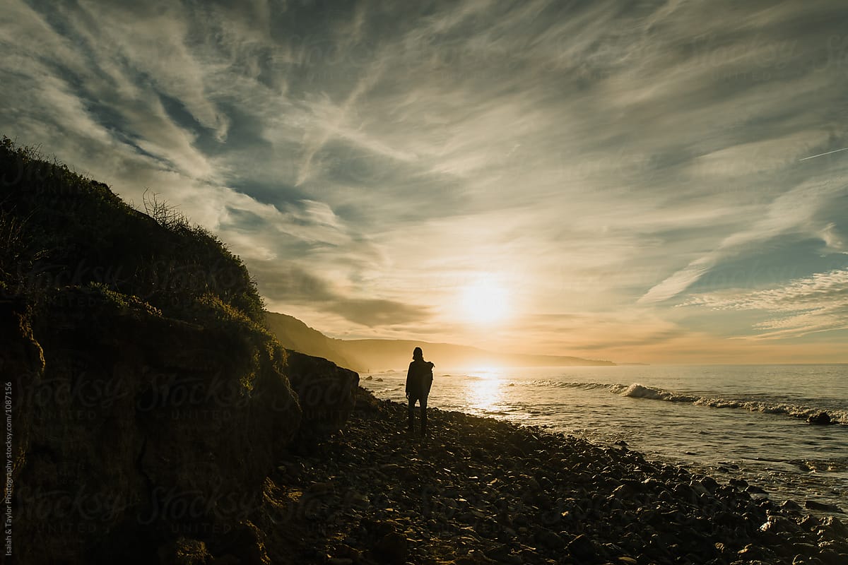 "Man Walking Into Sunrise" by Stocksy Contributor "Itla" - Stocksy