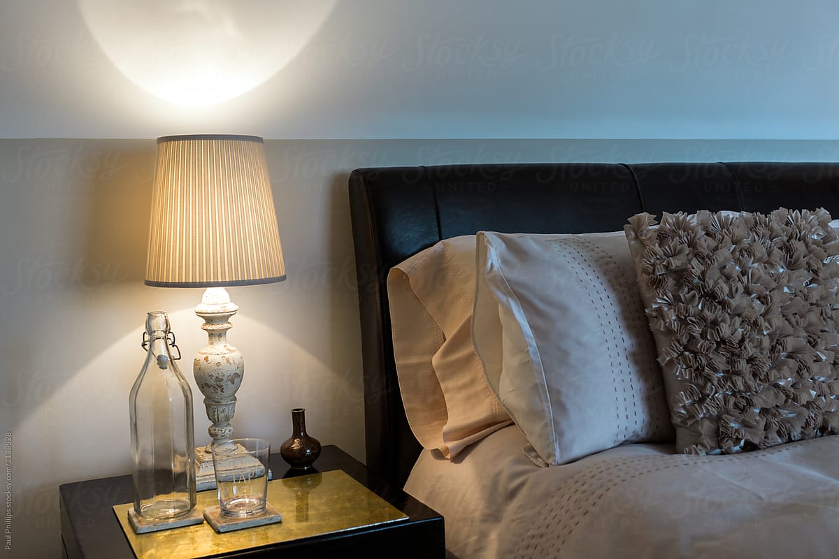 "Bedside Lamp And Corner Of Bed At Night." by Stocksy Contributor "Paul ...