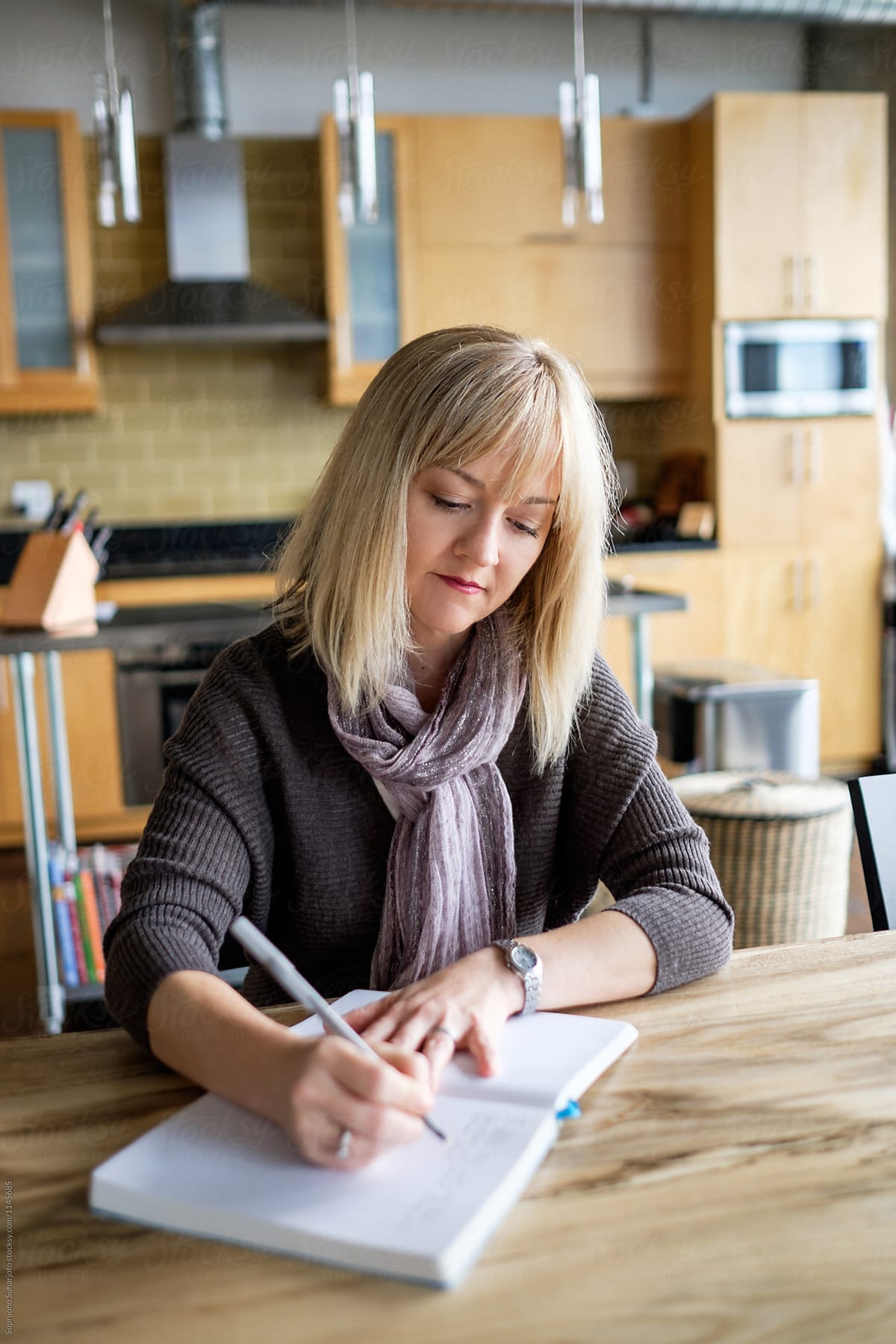 "Woman Writing On A Notebook At Home" by Stocksy Contributor "Take A ...