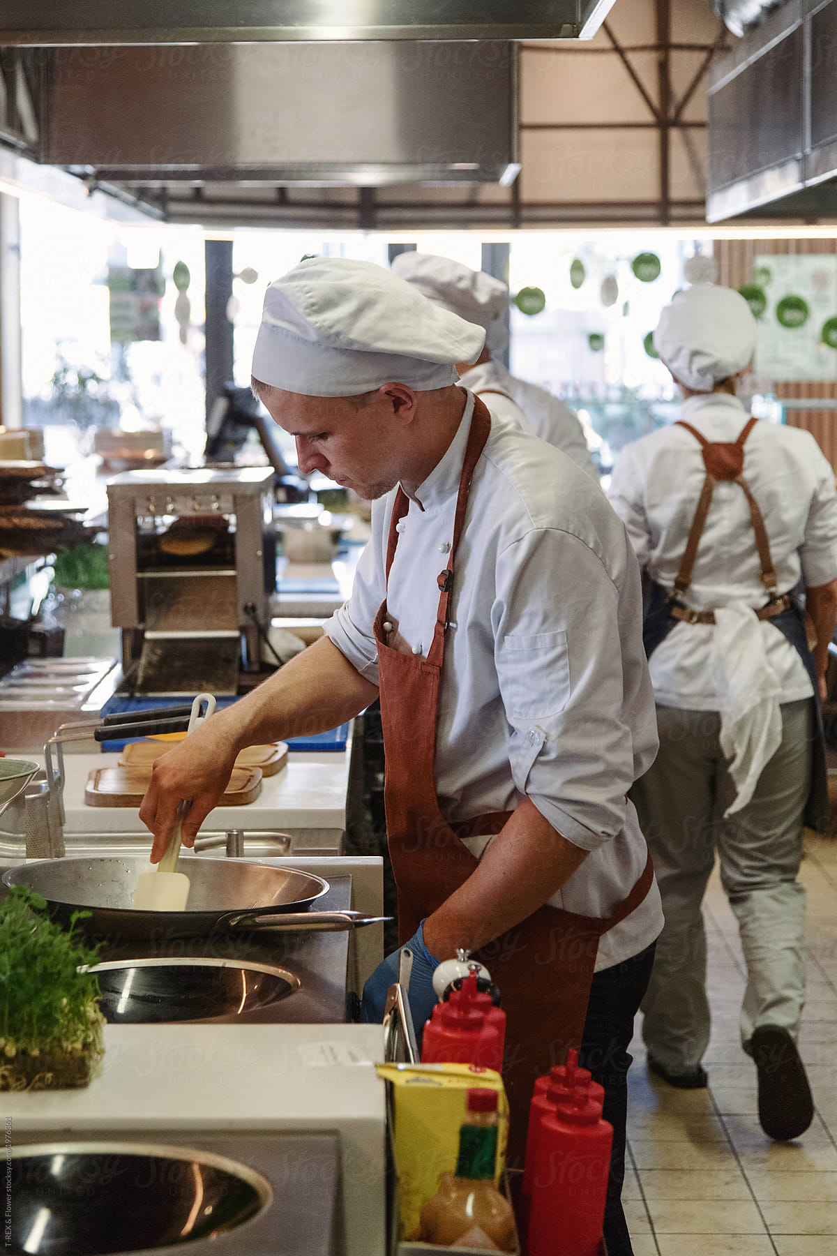 "Cook Working On Kitchen" by Stocksy Contributor "Danil Nevsky" - Stocksy