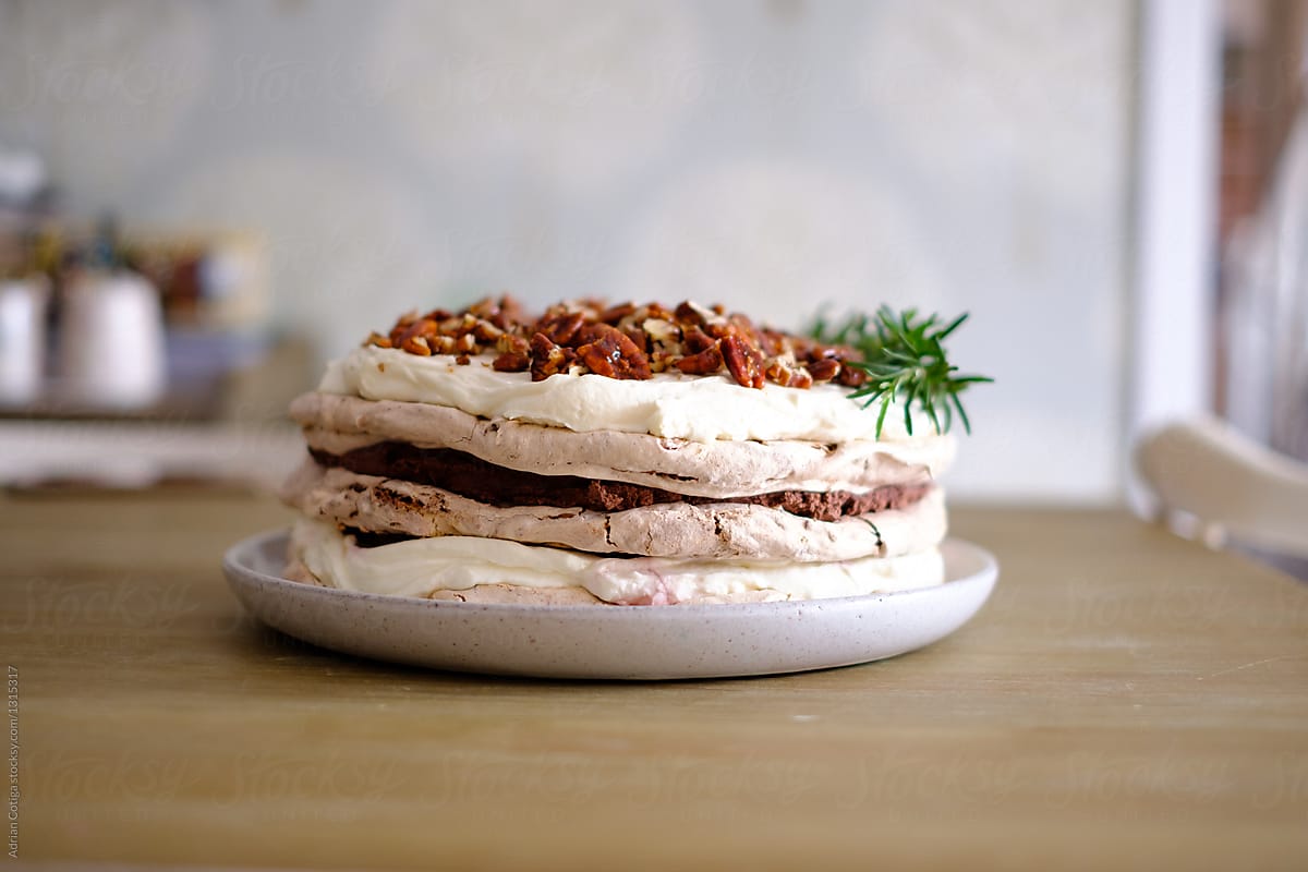 "Pecan Nuts Meringue Cake" by Stocksy Contributor "Adrian Cotiga" - Stocksy