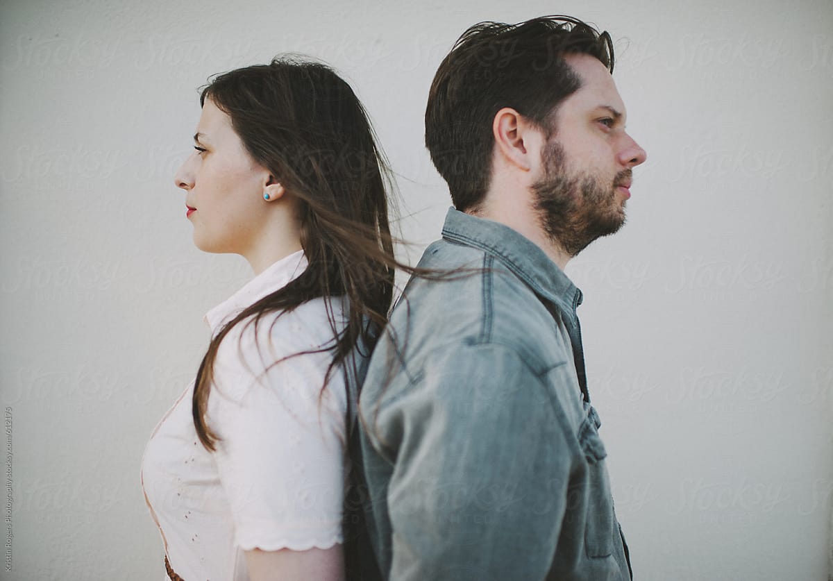 "Couple Standing Back To Back" by Stocksy Contributor "Kristin Rogers ...