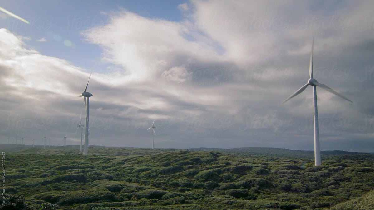 "Storm Clouds Behind A Wind Farm" by Stocksy Contributor "Adrian P ...