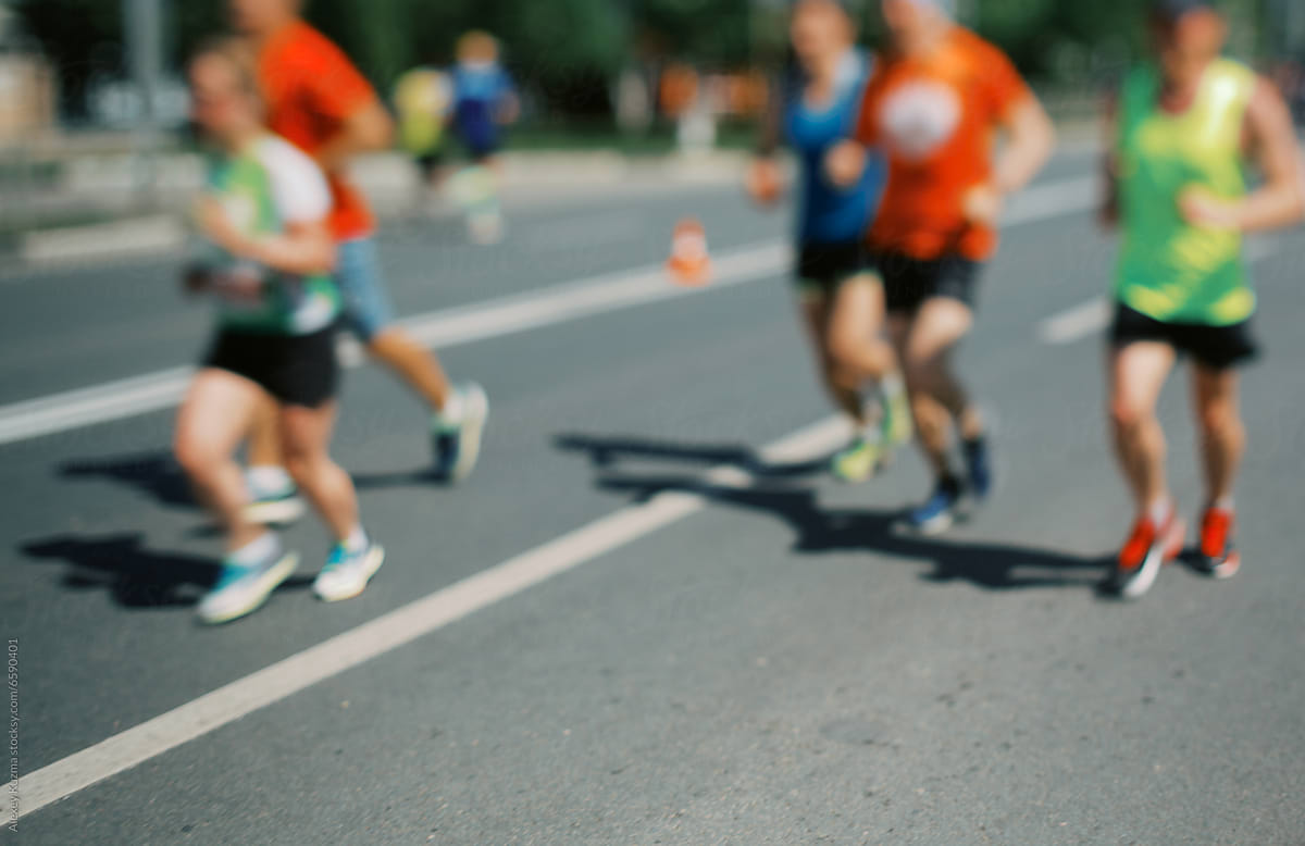 "Street Marathon" by Stocksy Contributor "Alexey Kuzma" - Stocksy