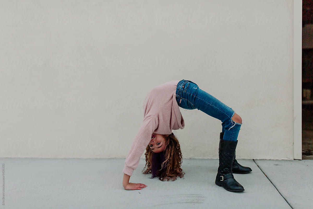 "Tween Girl Does Back Handstand" by Stocksy Contributor "Erin Brant ...