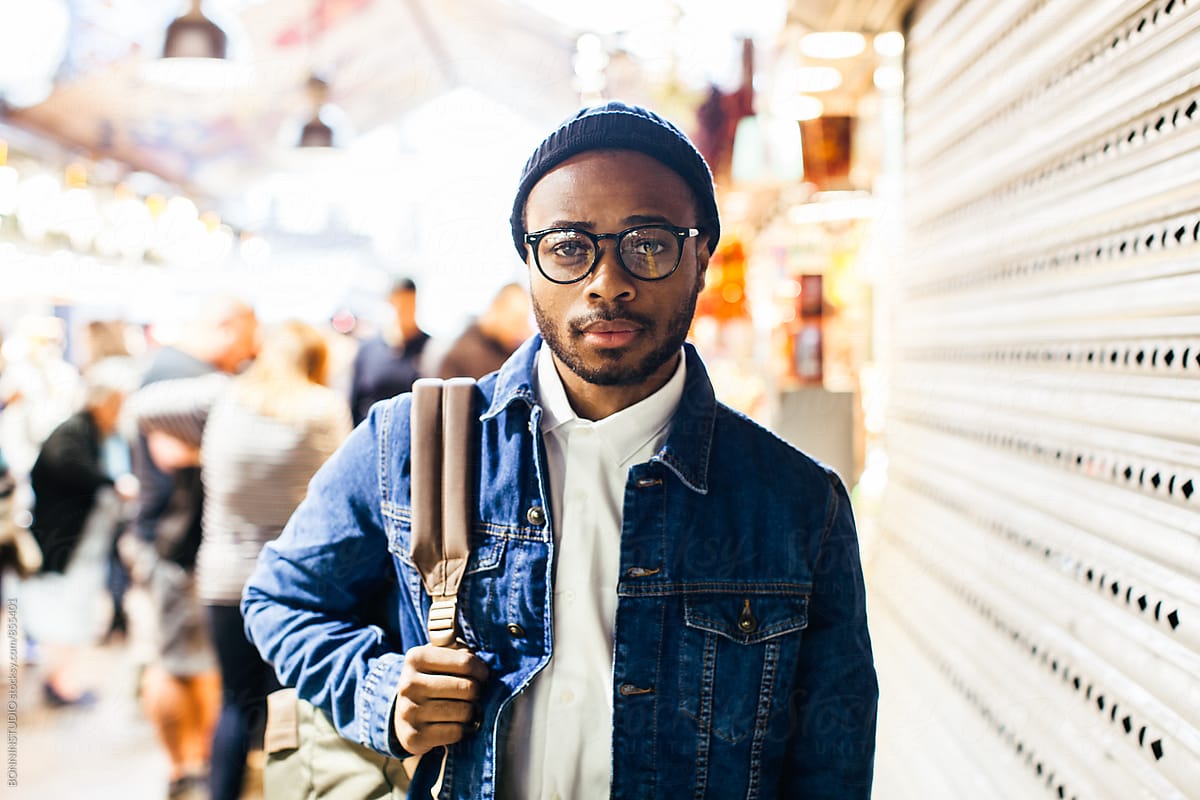"African American Man Standing In A Marketplace." by Stocksy ...