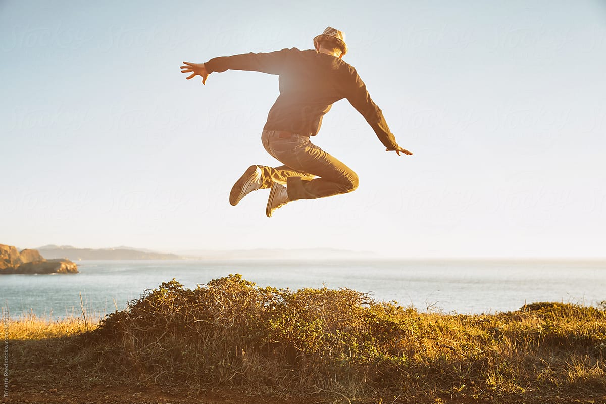 "Hipster Jumping Over Bush In Nature" by Stocksy Contributor "Trinette ...