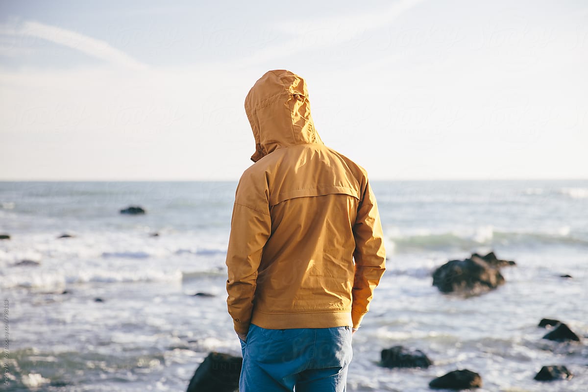 "Man Looking At The Ocean" by Stocksy Contributor "Andrey Pavlov" - Stocksy